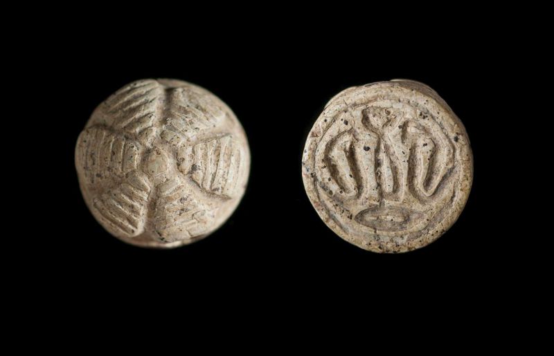 Rosette-shaped seal amulet displaying with a "wadj" sign between Uraei ...